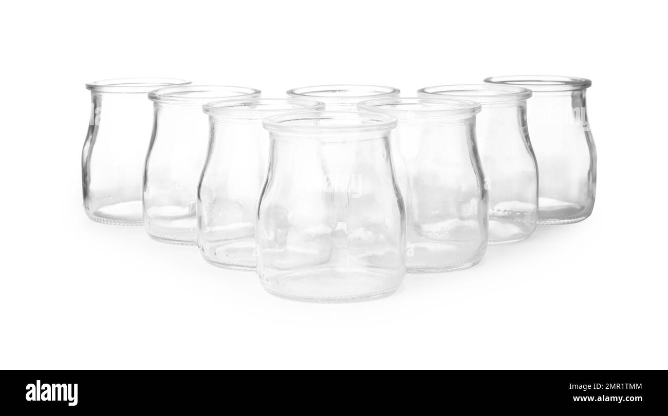 Empty clear glass jars isolated on white Stock Photo - Alamy