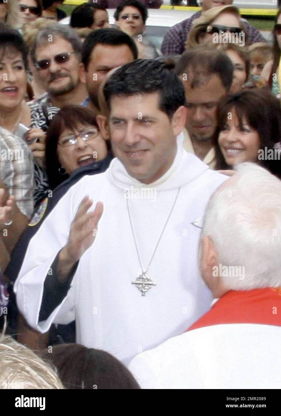 Father Alberto Cutie is greeted by crowds outside the Episcopal Church ...