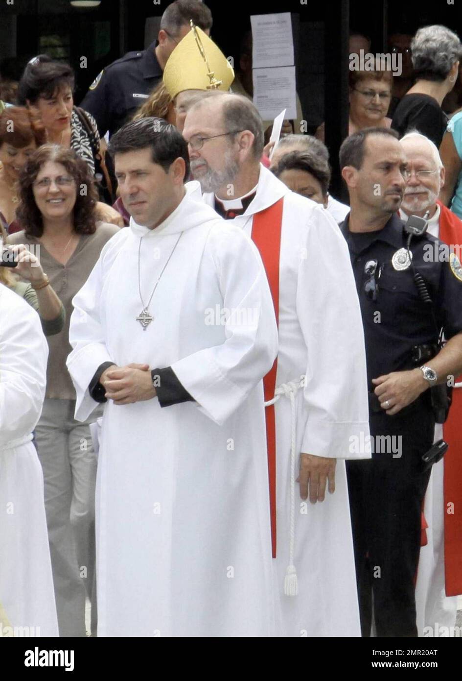 Father Alberto Cutie is greeted by crowds outside the Episcopal Church ...