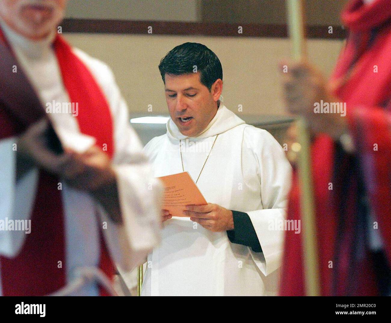 POOL PHOTO - Father Alberto Cutie is greeted by crowds outside the ...