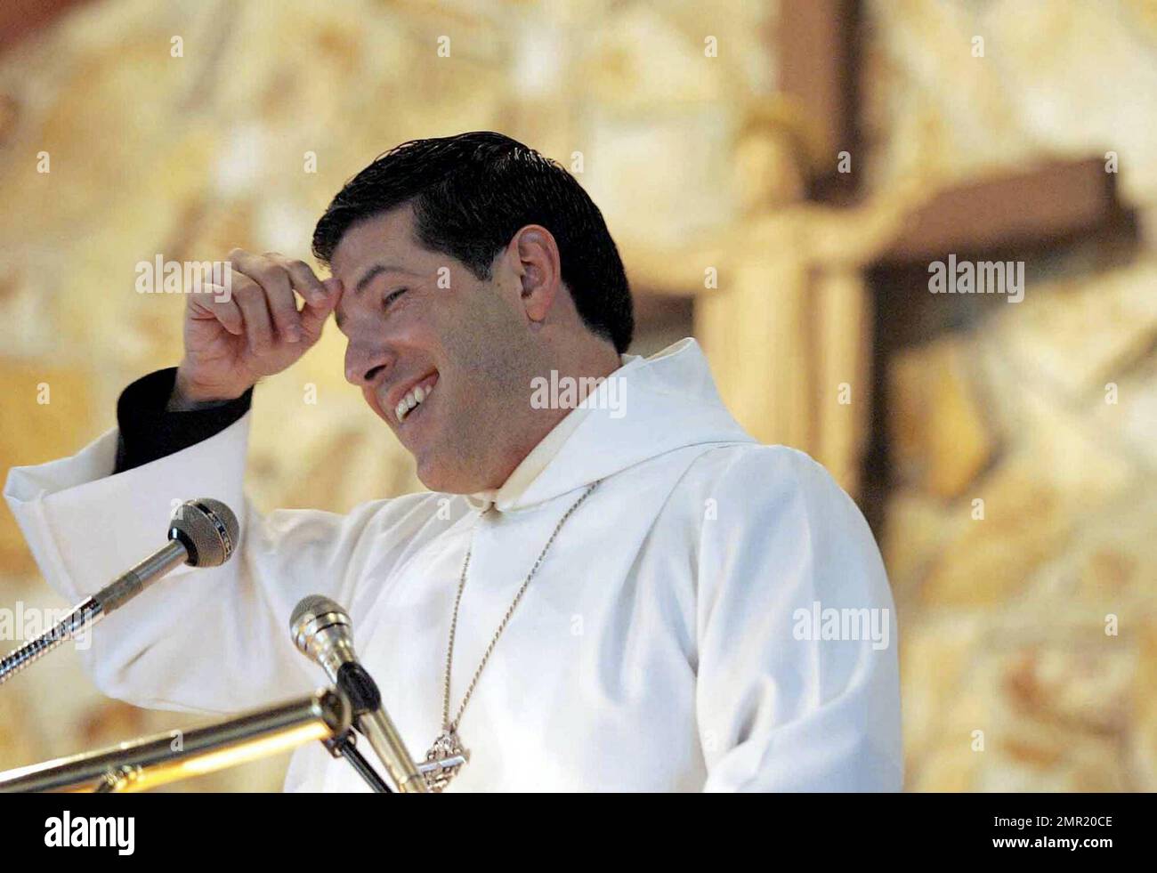 POOL PHOTO - Father Alberto Cutie is greeted by crowds outside the ...