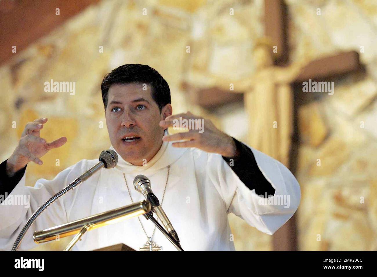 POOL PHOTO - Father Alberto Cutie is greeted by crowds outside the ...