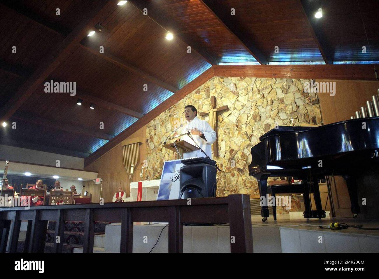 POOL PHOTO - Father Alberto Cutie is greeted by crowds outside the ...