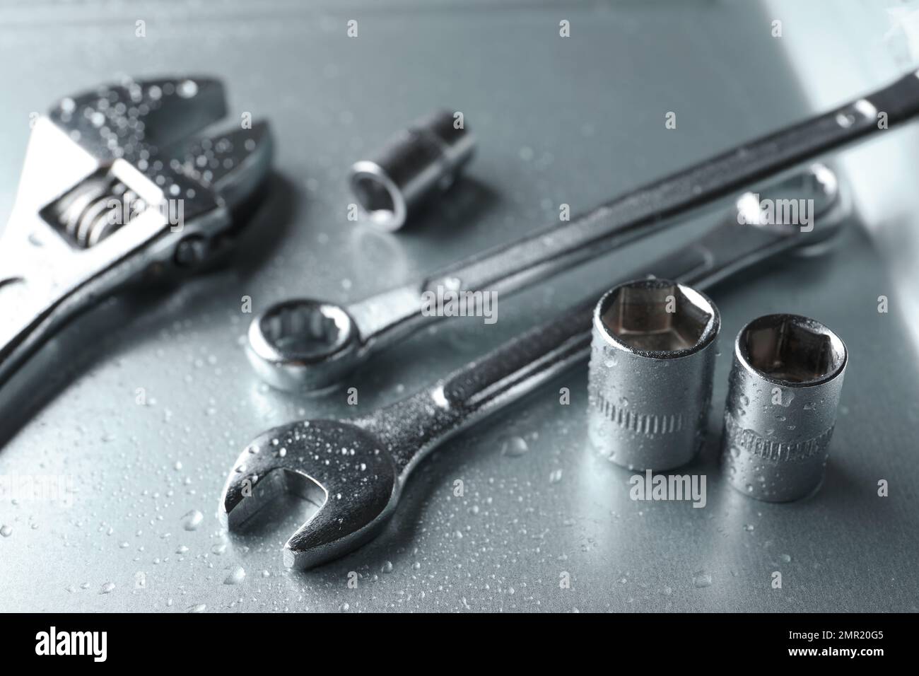 Auto mechanic's tools on metallic surface, closeup Stock Photo - Alamy