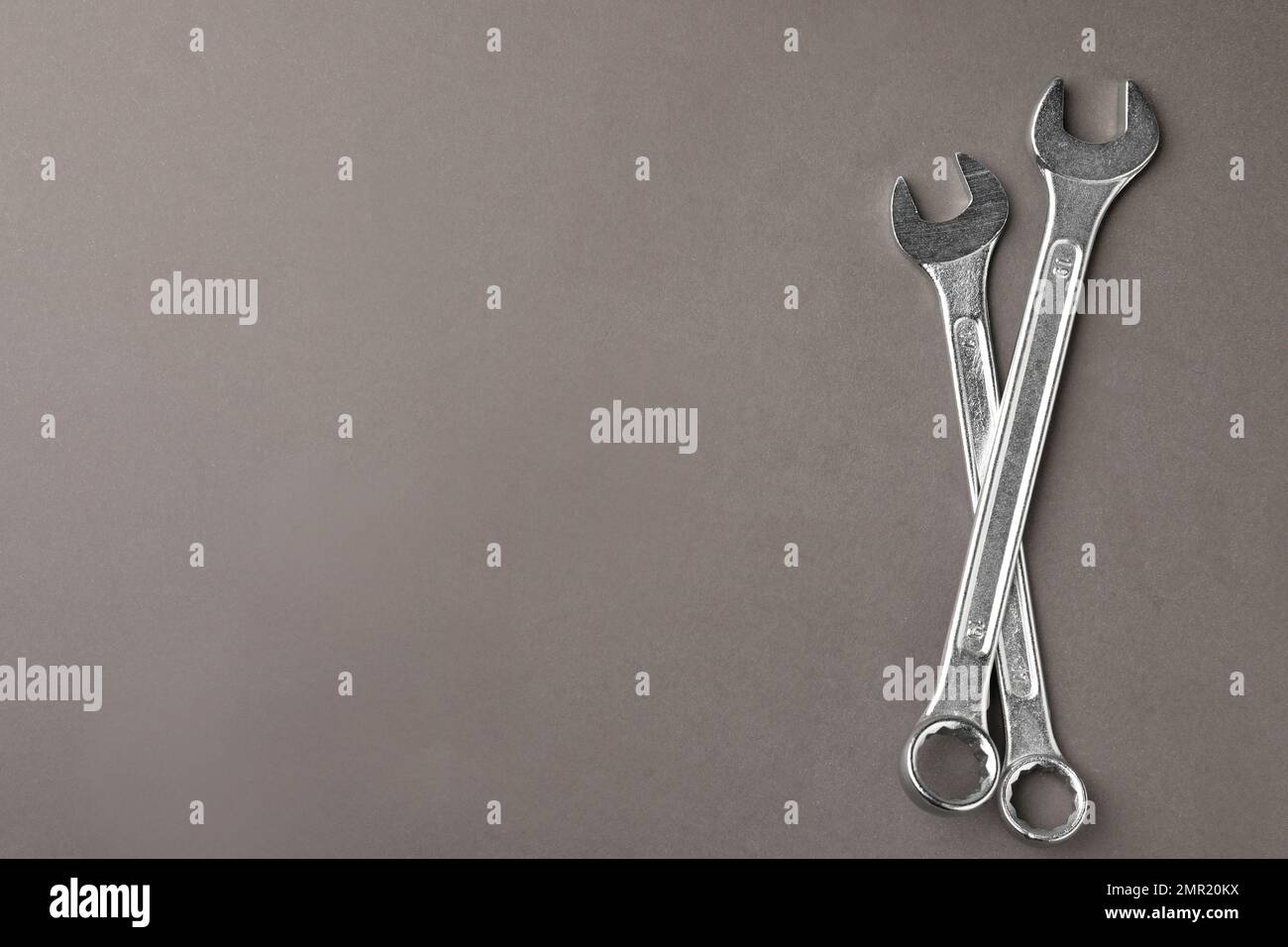 Auto mechanic's tools on grey background, flat lay. Space for text ...