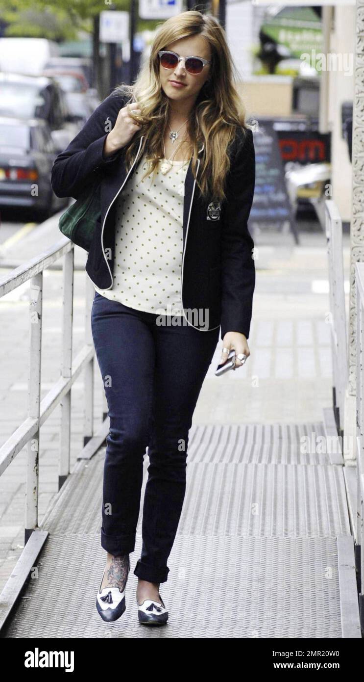 TV and radio personality Fearne Cotton chats on her cellphone as she ...