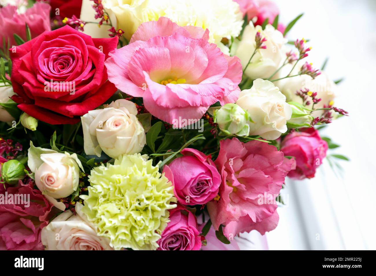 Beautiful fresh flowers on light background, closeup. Floral decor ...
