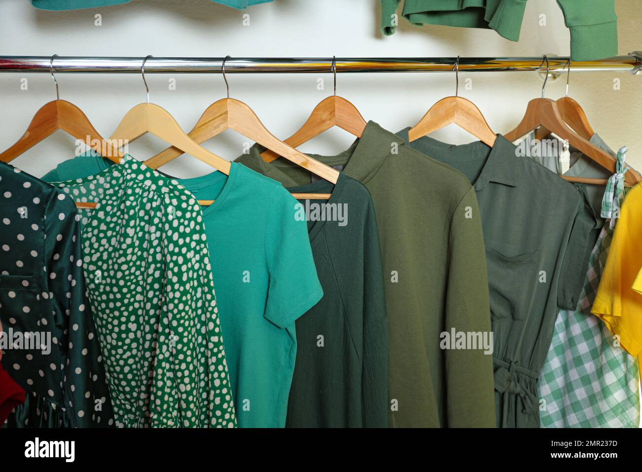 Hangers different clothes in wardrobe hi-res stock photography and ...