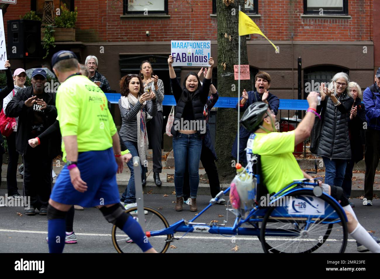 A wheelchair participant along Lafayette Avenue in the Brooklyn borough ...