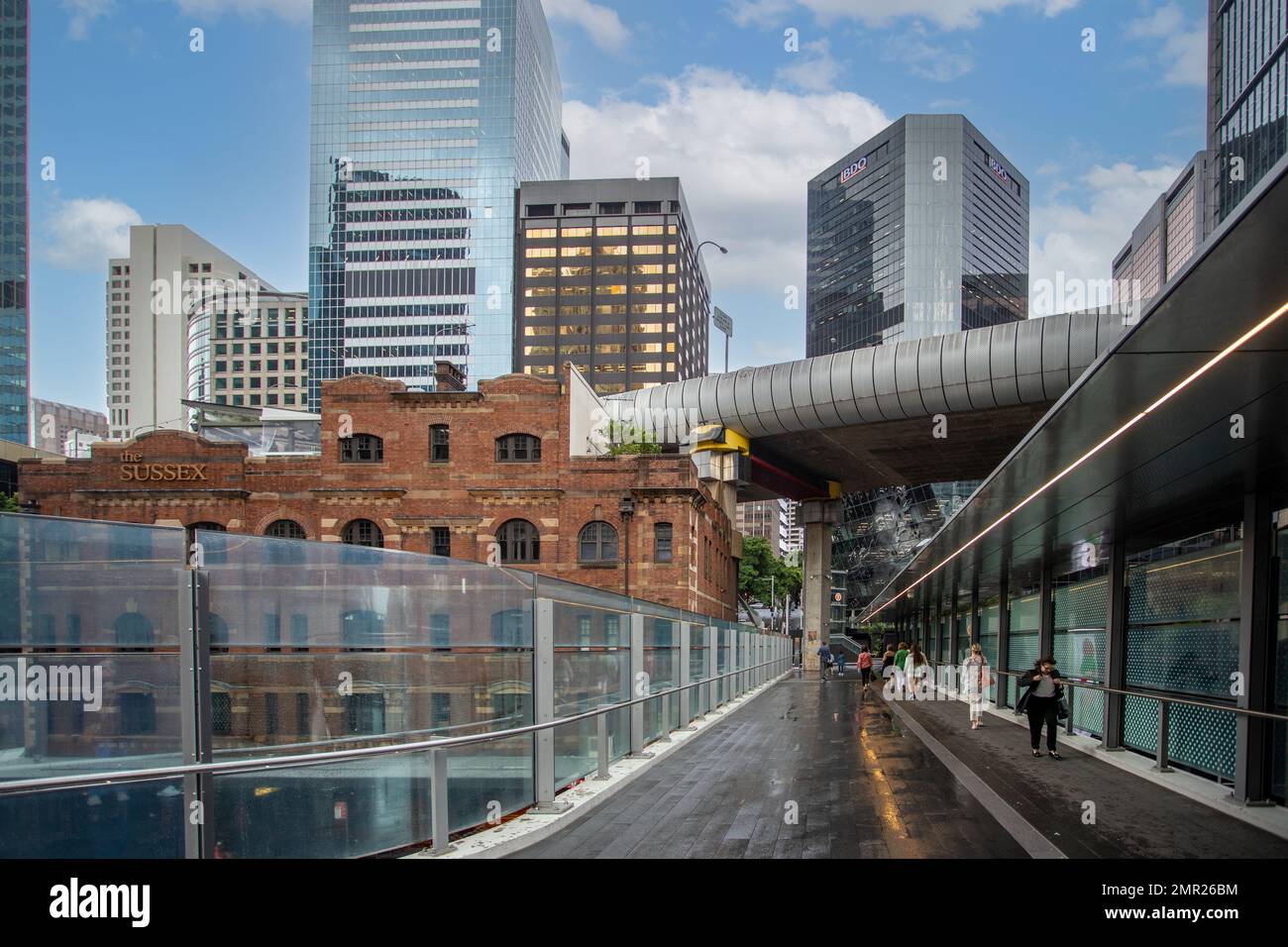 Elevated walkway from Wynyard Station to Barangaroo amidst modern ...