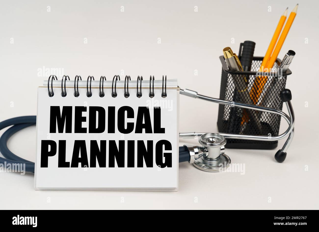 Medical concept. On the table are office supplies, a stethoscope and a ...