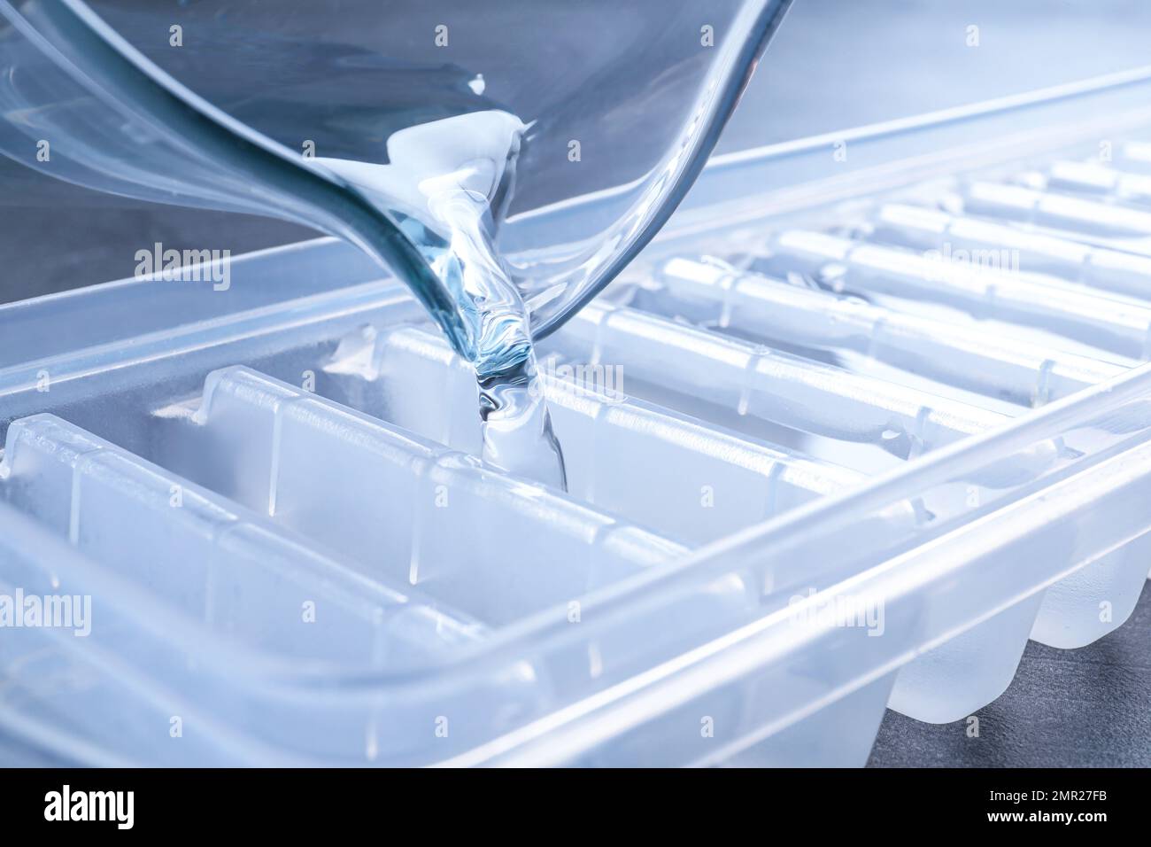 Pouring water into ice tray hi-res stock photography and images - Alamy