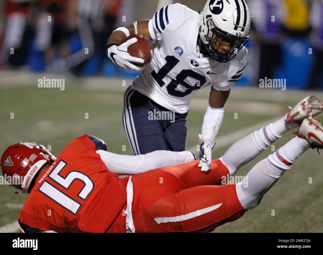 BYU's Michael Shelton tires to avoid Fresno State's Arron Mosby during ...