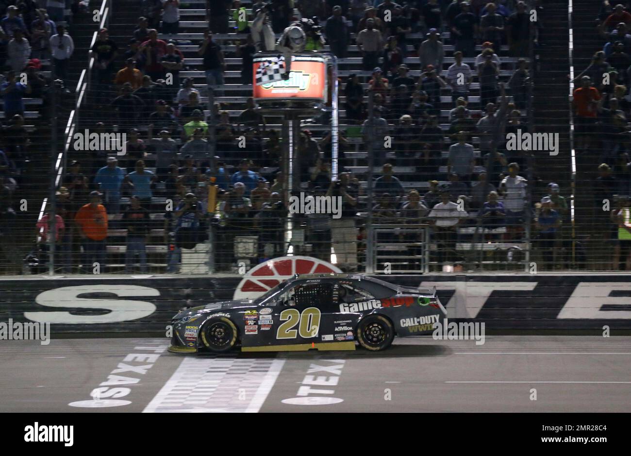 Erik Jones (20) crosses the finish line to win a NASCAR Xfinity series ...