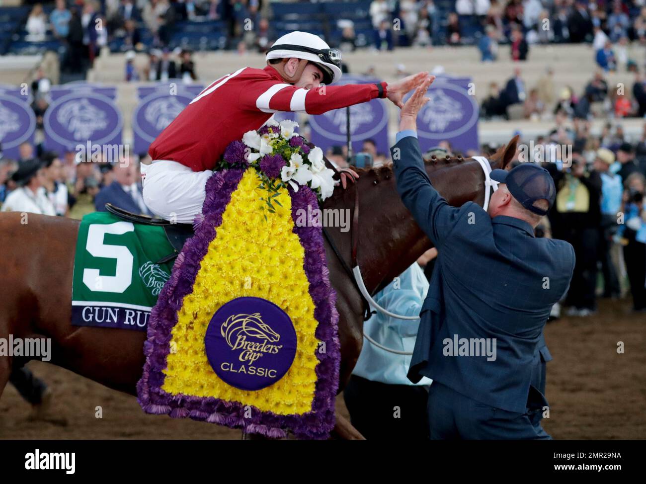 Florent Geroux celebrates after riding Gun Runner to victory in the ...