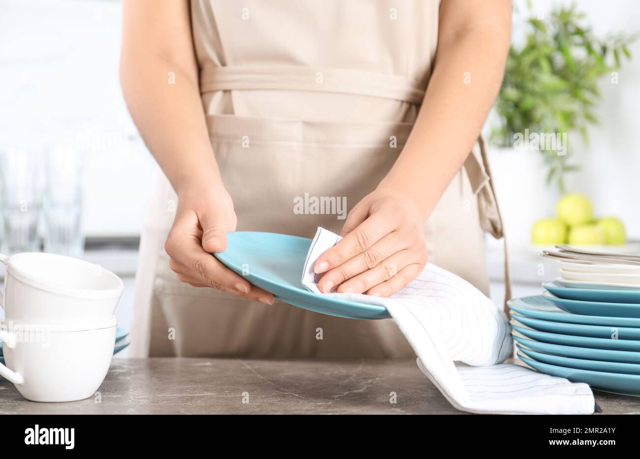 Young housewife wiping clean dishes hi-res stock photography and images ...