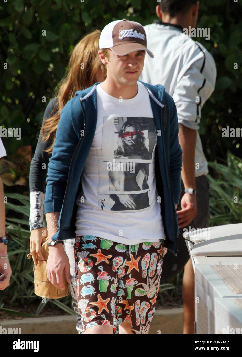 Harry Potter baddie, Tom Felton, emerges on New Years Day to enjoy a ...