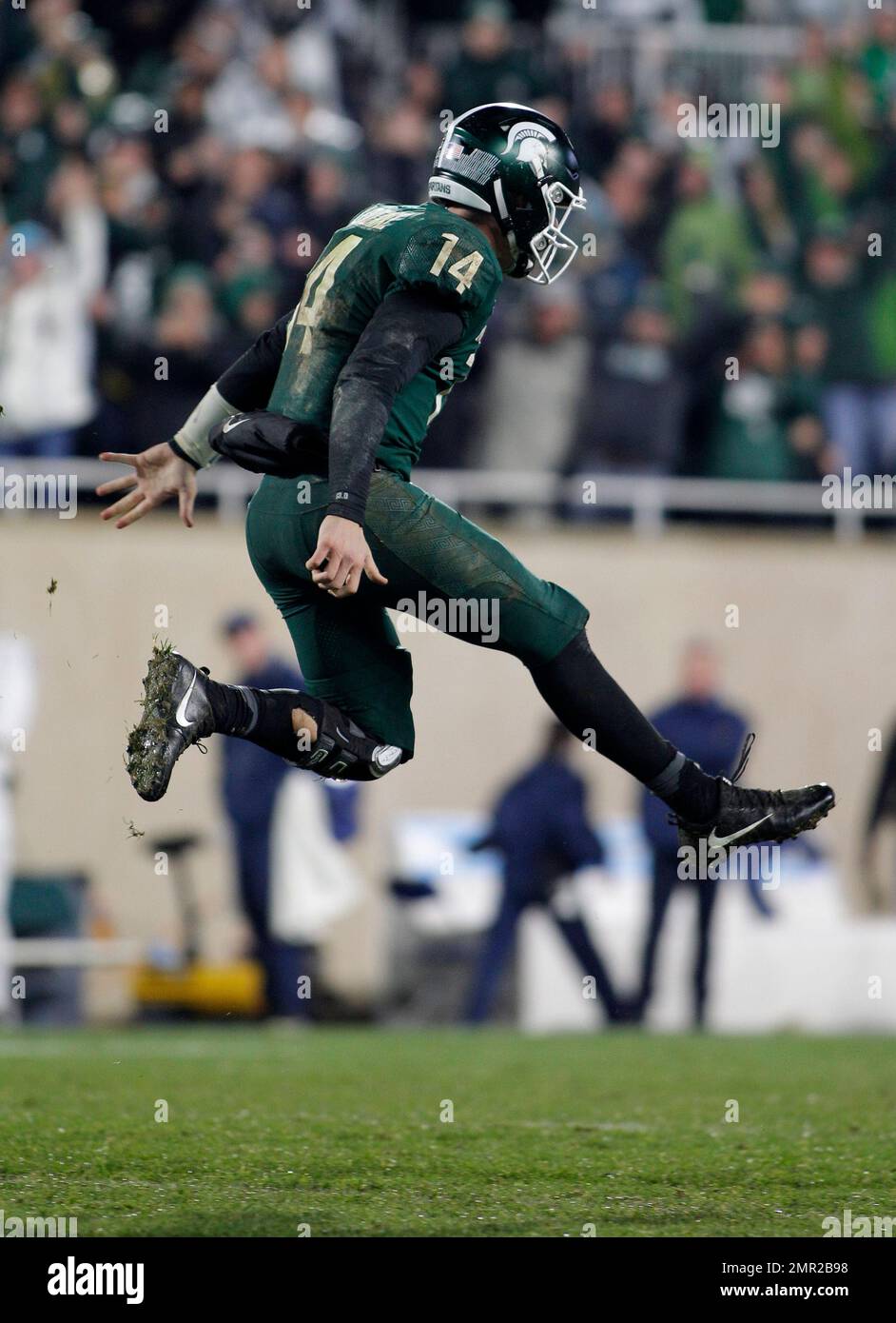 Michigan State quarterback Brian Lewerke celebrates at the conclusion ...