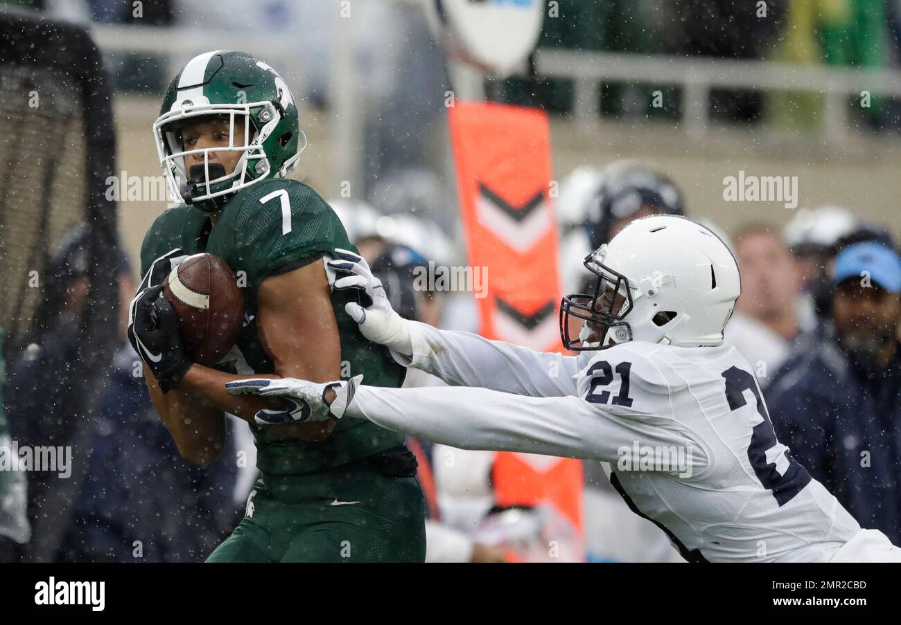 Penn State cornerback Amani Oruwariye (21) pushes Michigan State wide ...