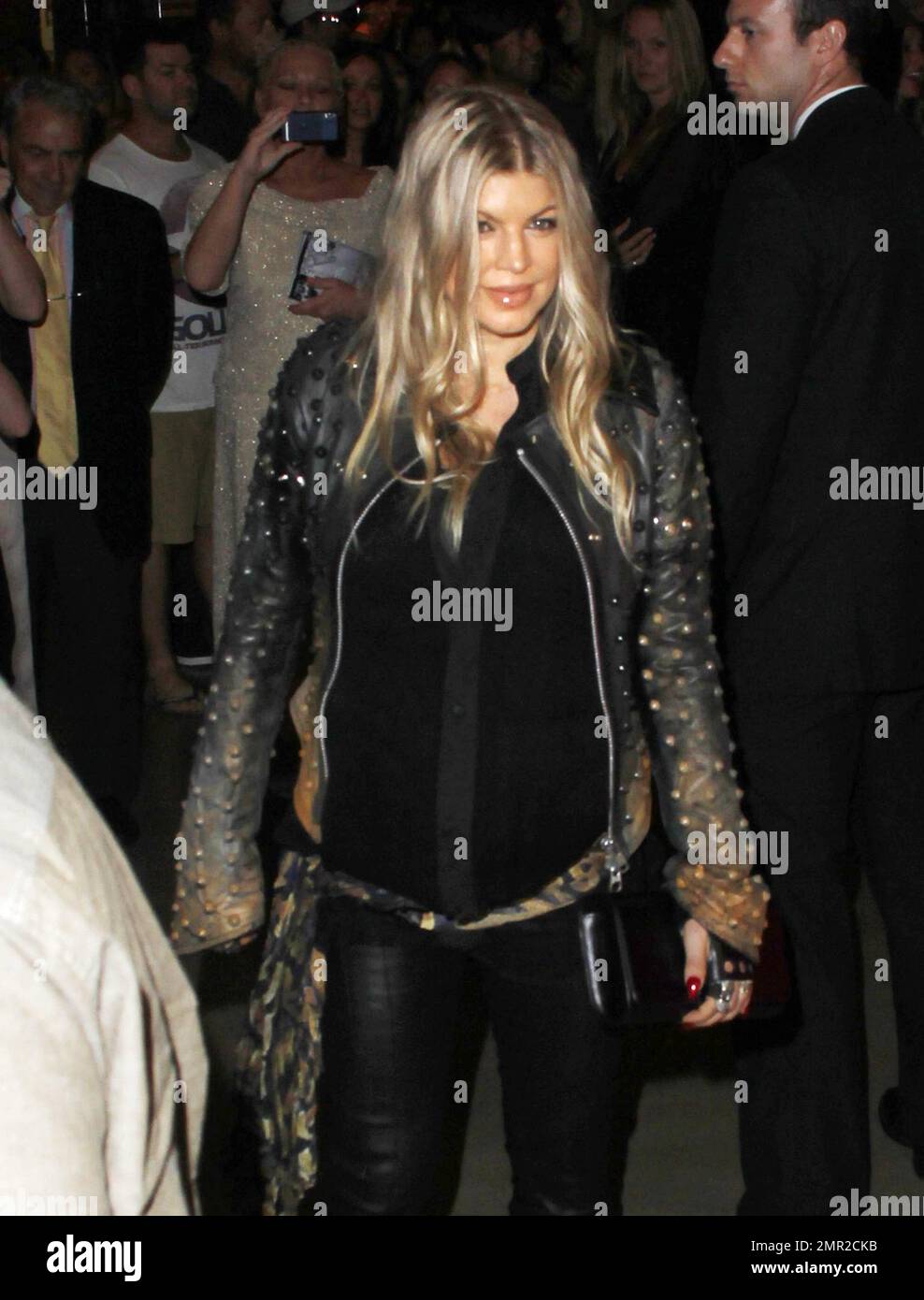 Showing off her baby bump as she awaits the arrival of her first child ...