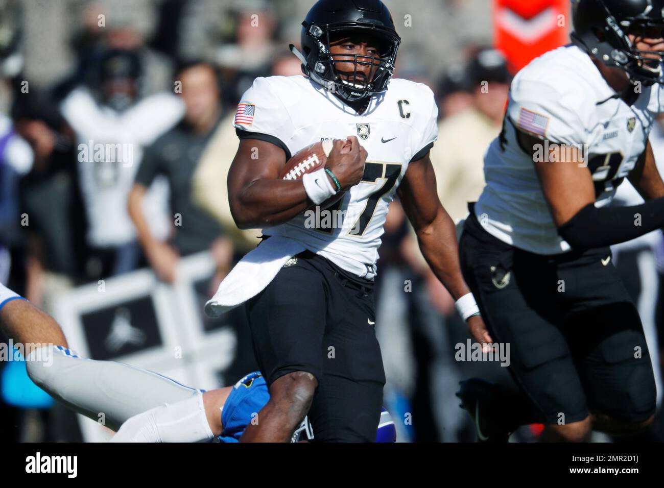 Army quarterback Ahmad Bradshaw eludes an Air Force defender on the way ...