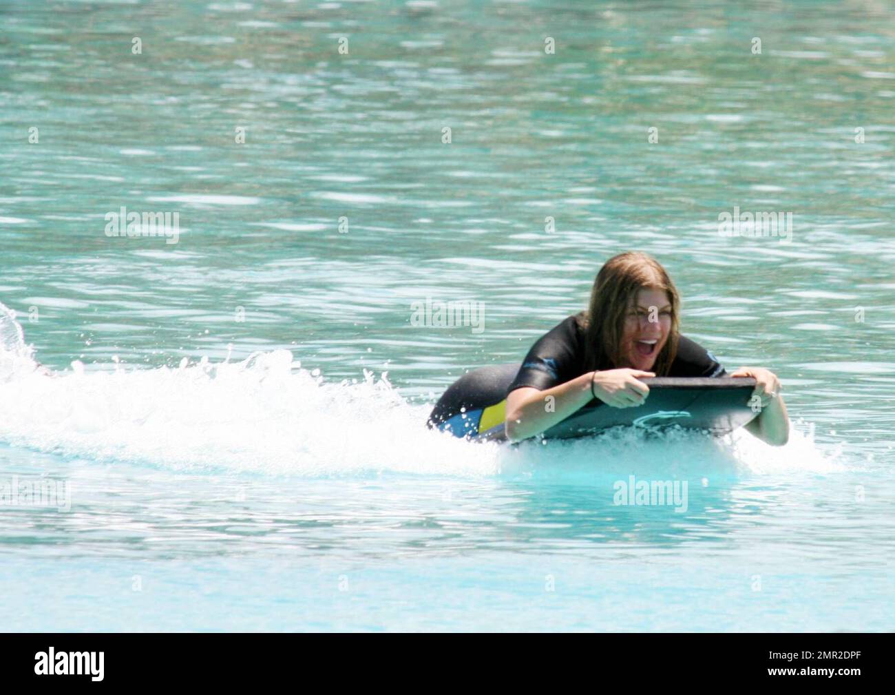 Exclusive!! Fergie goes for a dolphin experience at Atlantis Resort in ...