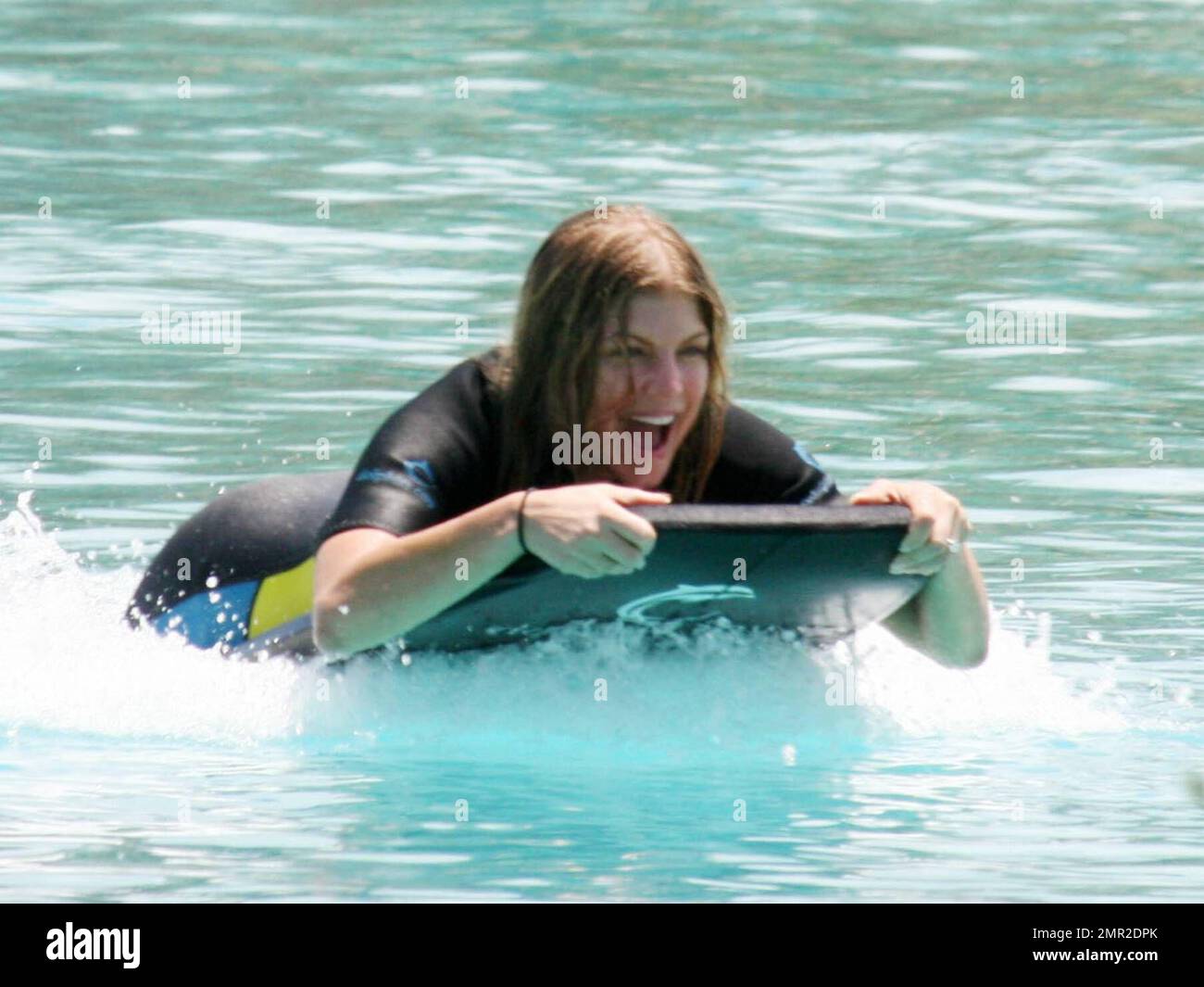 Exclusive!! Fergie goes for a dolphin experience at Atlantis Resort in ...