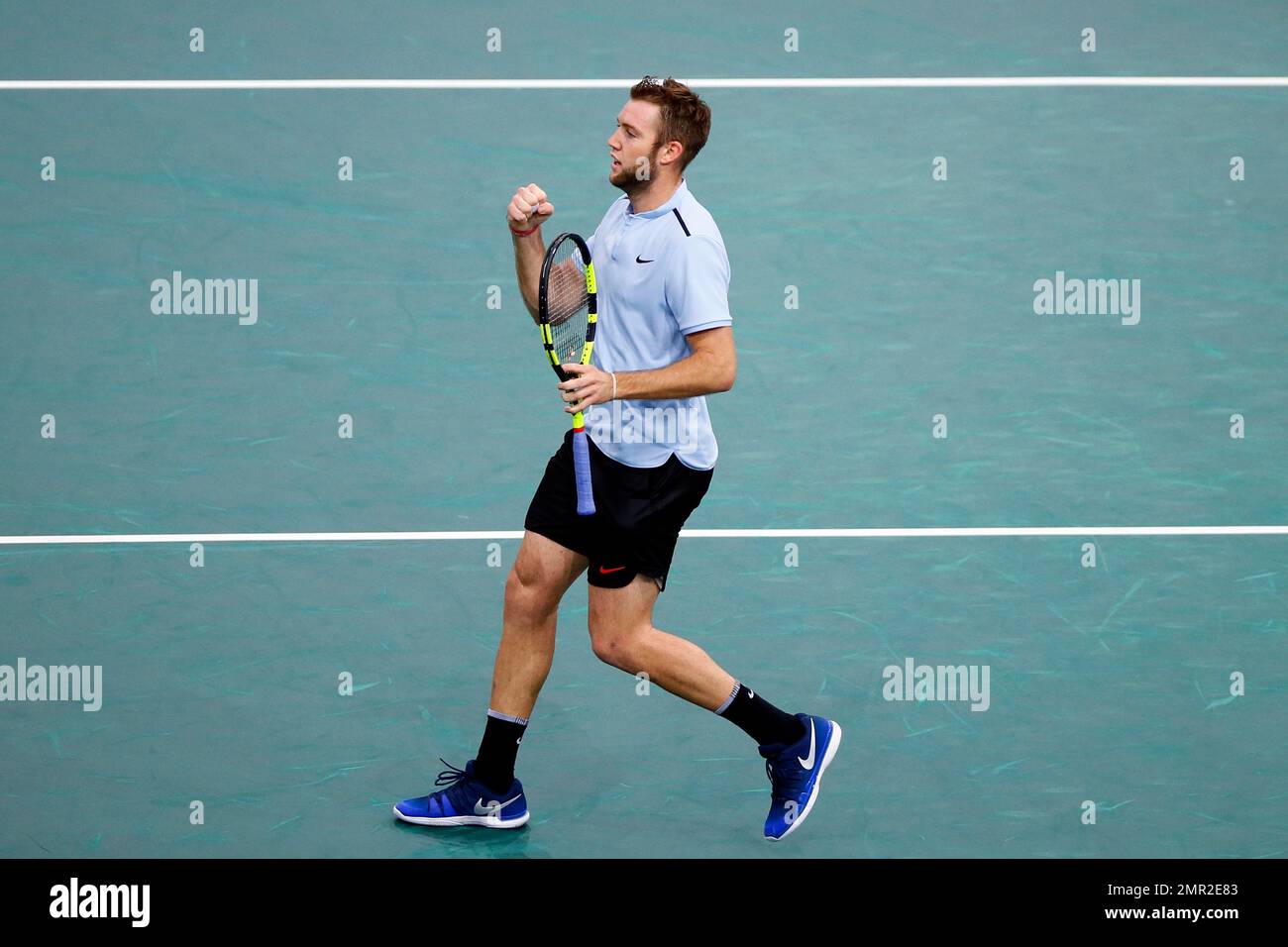 Jack Sock of the United States reacts after winning the first set ...