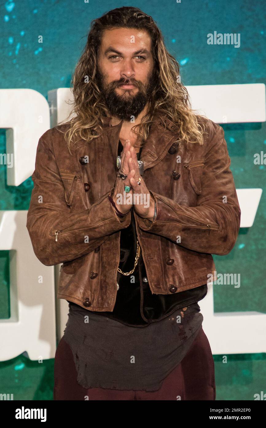 Actor Jason Momoa poses for photographers upon arrival at a photo call ...