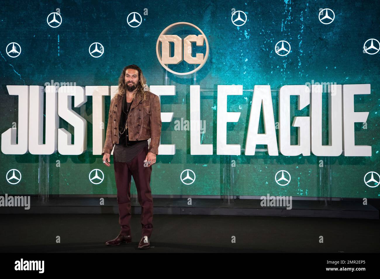 Actor Jason Momoa poses for photographers upon arrival at a photo call ...