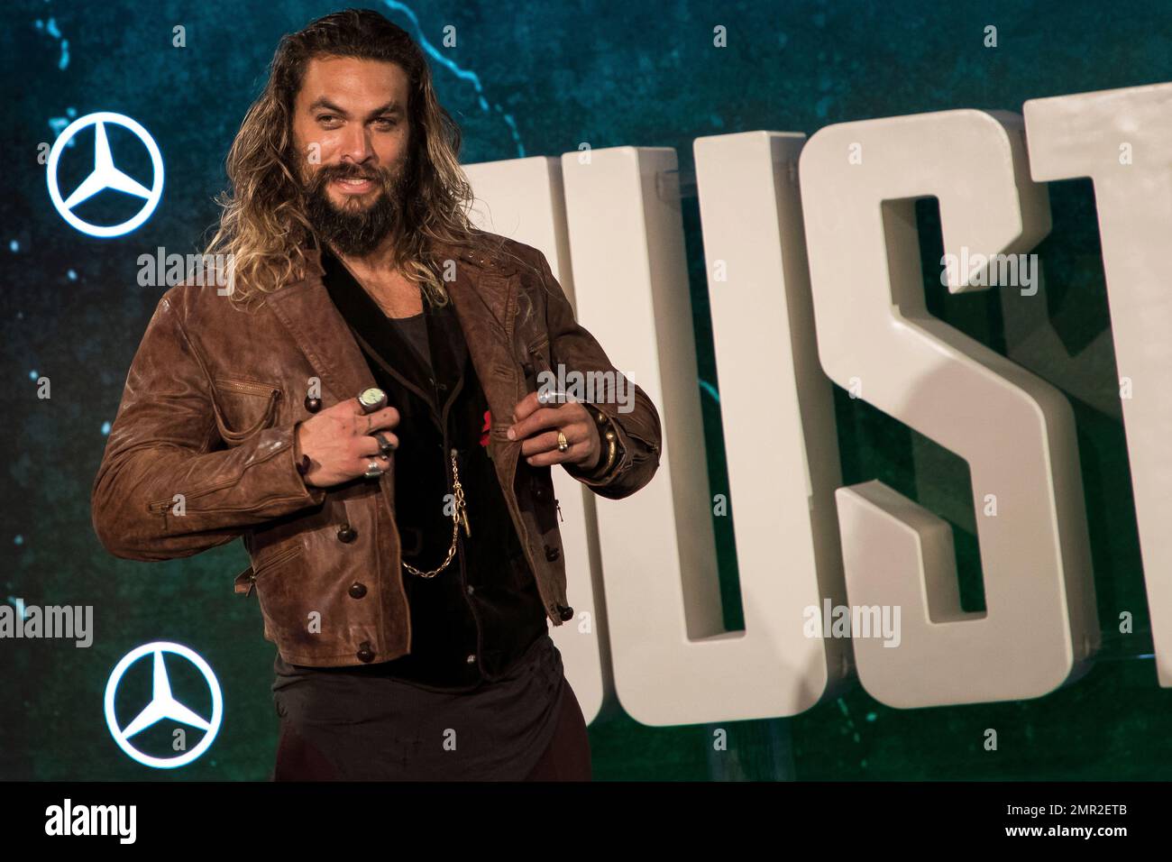 Actor Jason Momoa poses for photographers upon arrival at a photo call ...