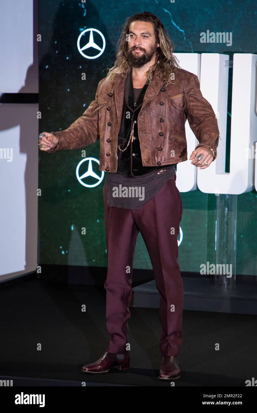 Actor Jason Momoa poses for photographers upon arrival at a photo call ...