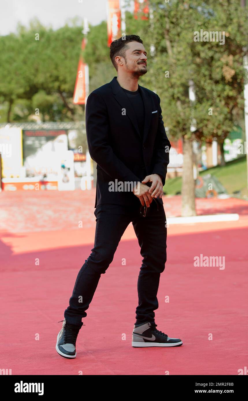 Actor Orlando Bloom arrives on the red carpet for the film 'Romans' at ...