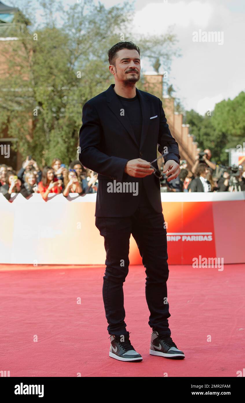 Actor Orlando Bloom arrives on the red carpet for the film 'Romans' at ...