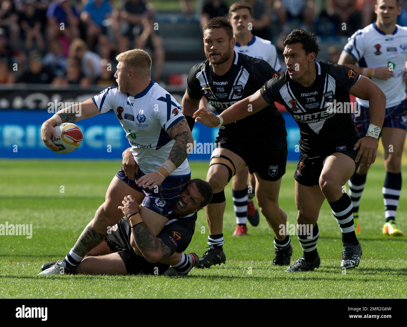 Scotland's Danny Addy looks to pass the ball as he is tackled by New ...