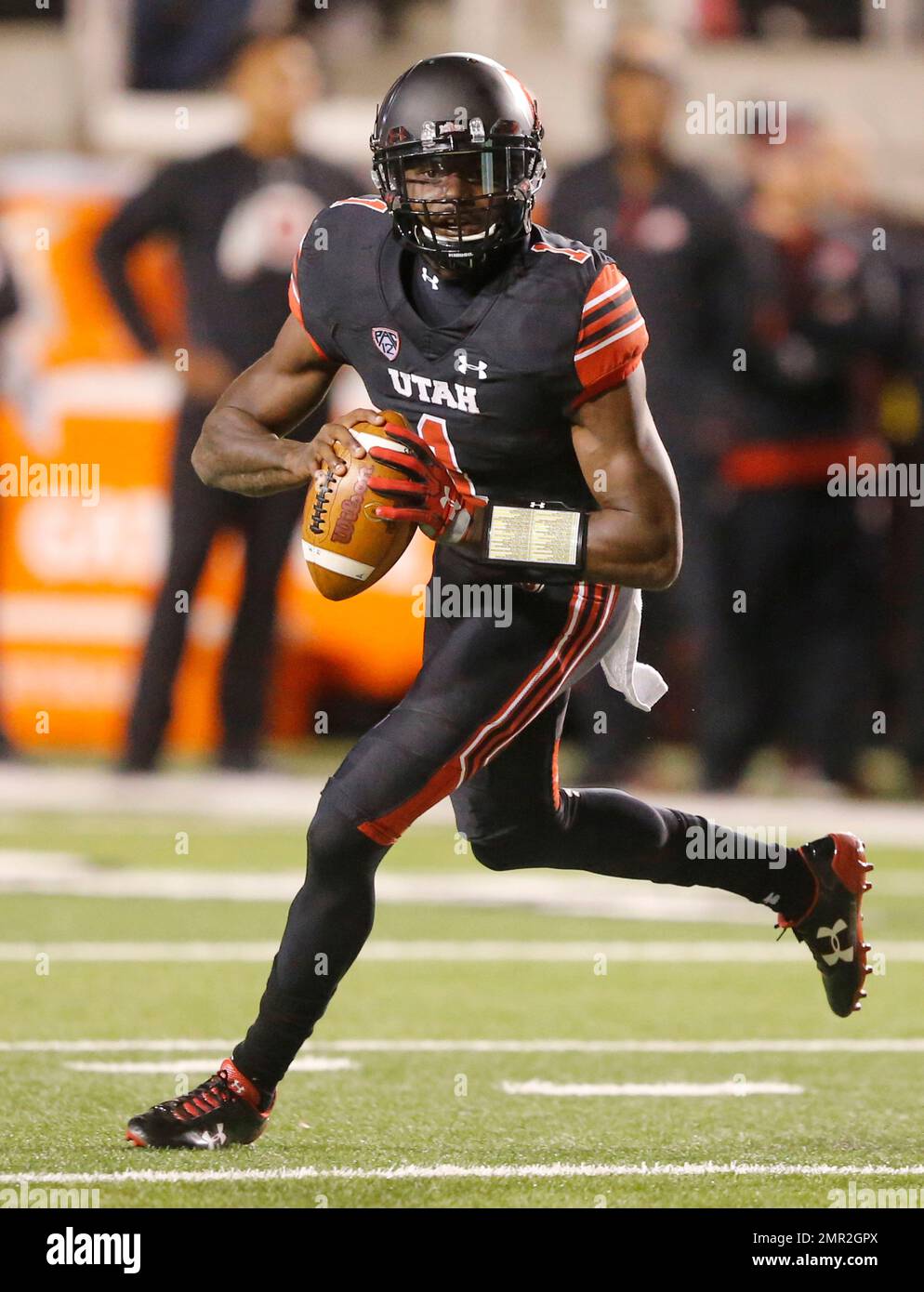 Utah quarterback Tyler Huntley looks downfield during the first half of ...