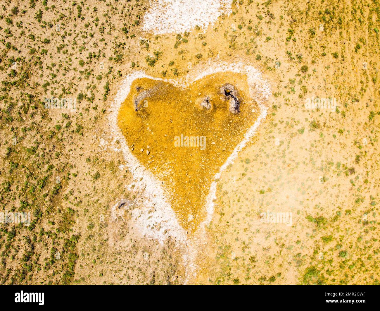 Top down view orange heart shape form on mud volcanoes site in chachuna ...