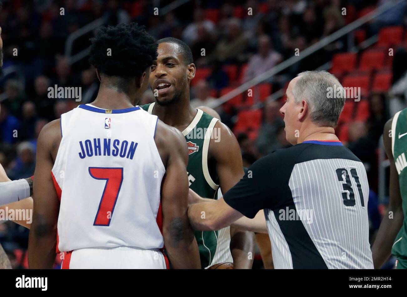 Referee Scott Wall separates Detroit Pistons forward Stanley Johnson (7 ...