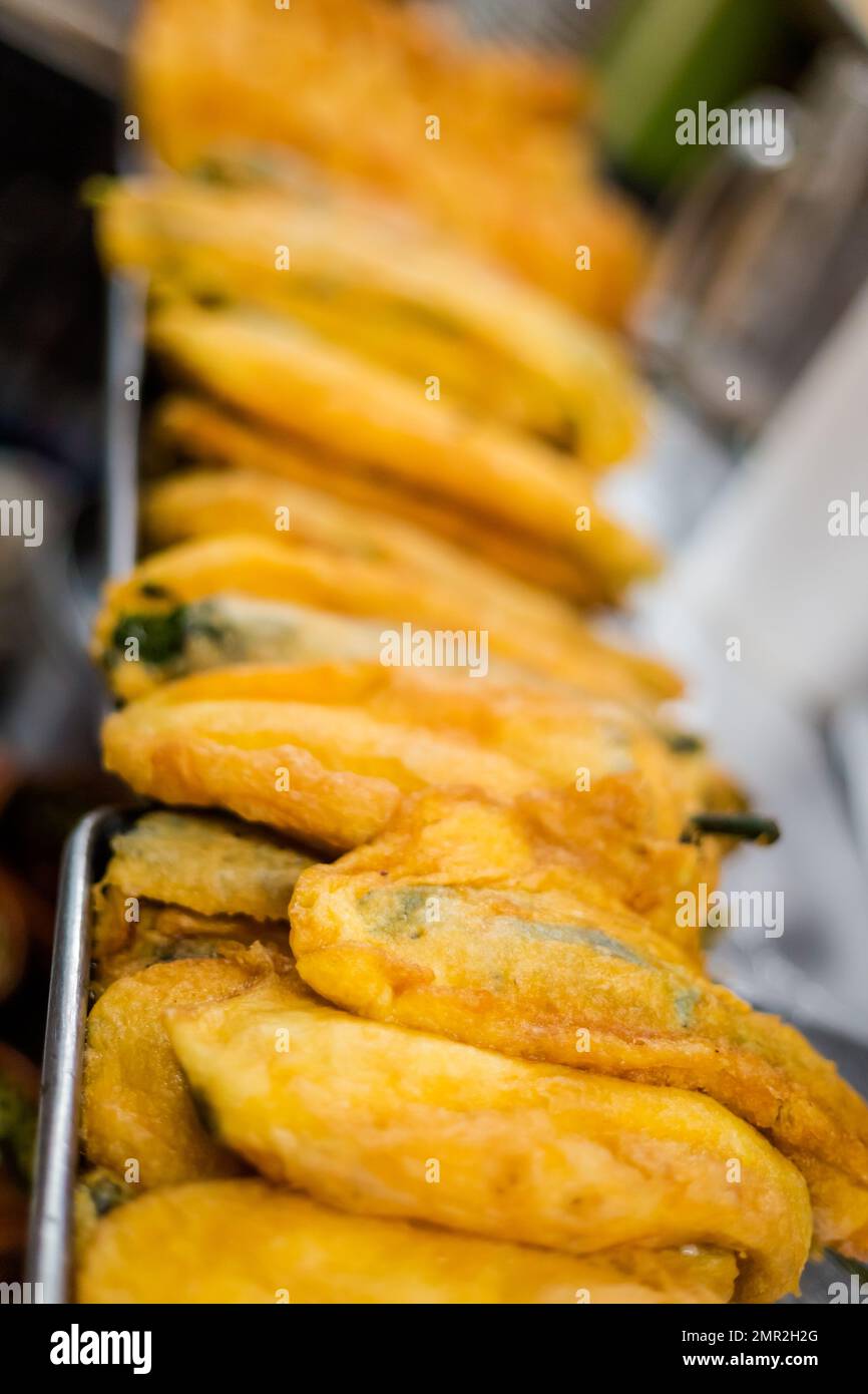 Fresh prepared fried stuffed poblano peppers - chille relleno served on ...