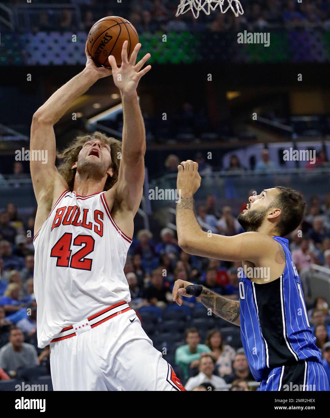 Chicago Bulls' Robin Lopez (42) attempts a shot in front of Orlando ...