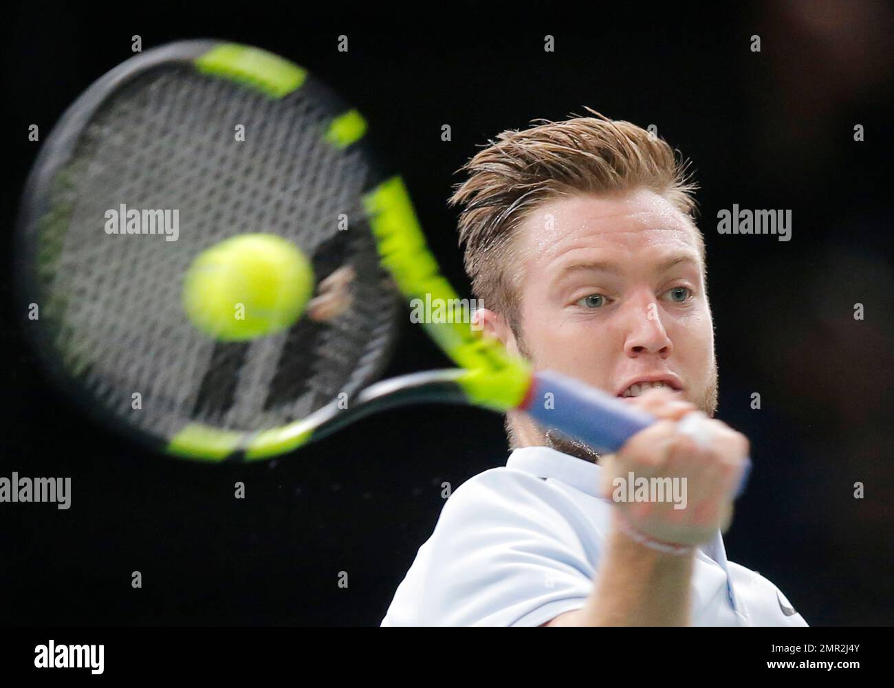 Jack Sock of the United States returns the ball to Fernando Verdasco of ...