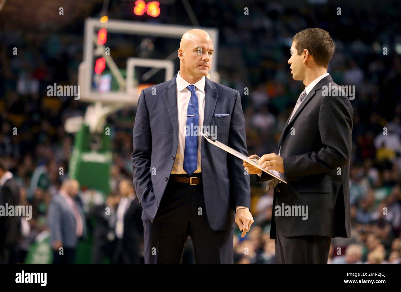 Boston Celtics head coach Brad Stevens, right, talks with assistant ...