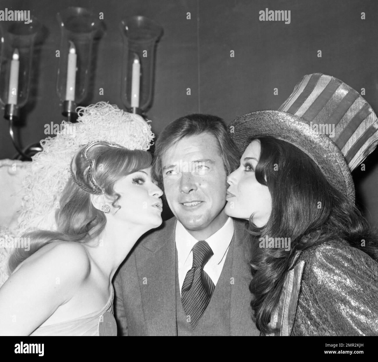 Roger Moore gets a double kiss from Miss United Kingdom, Marilyn Ann ...