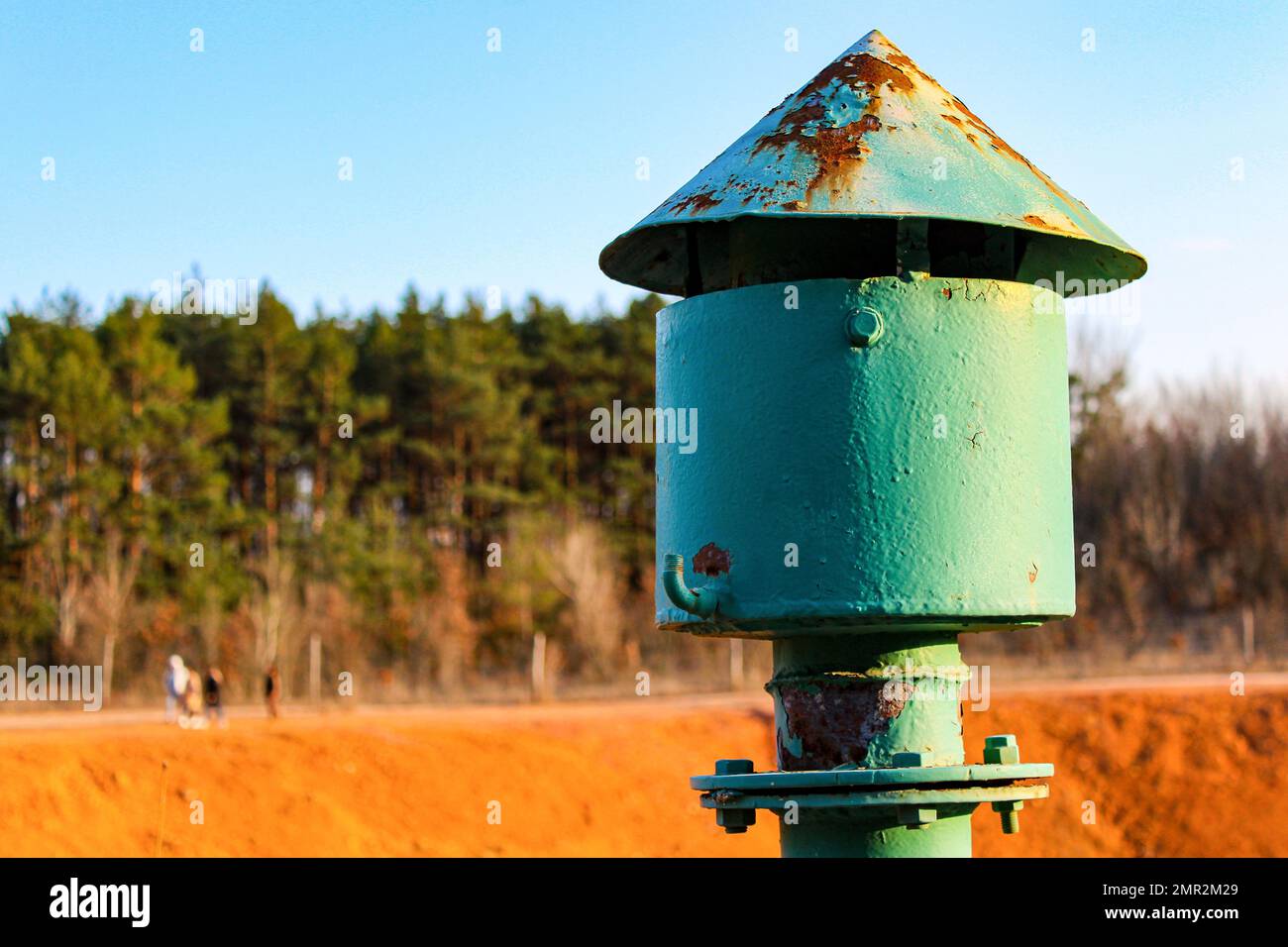 Bauxite mine ventilation pipe with forest background Stock Photo - Alamy