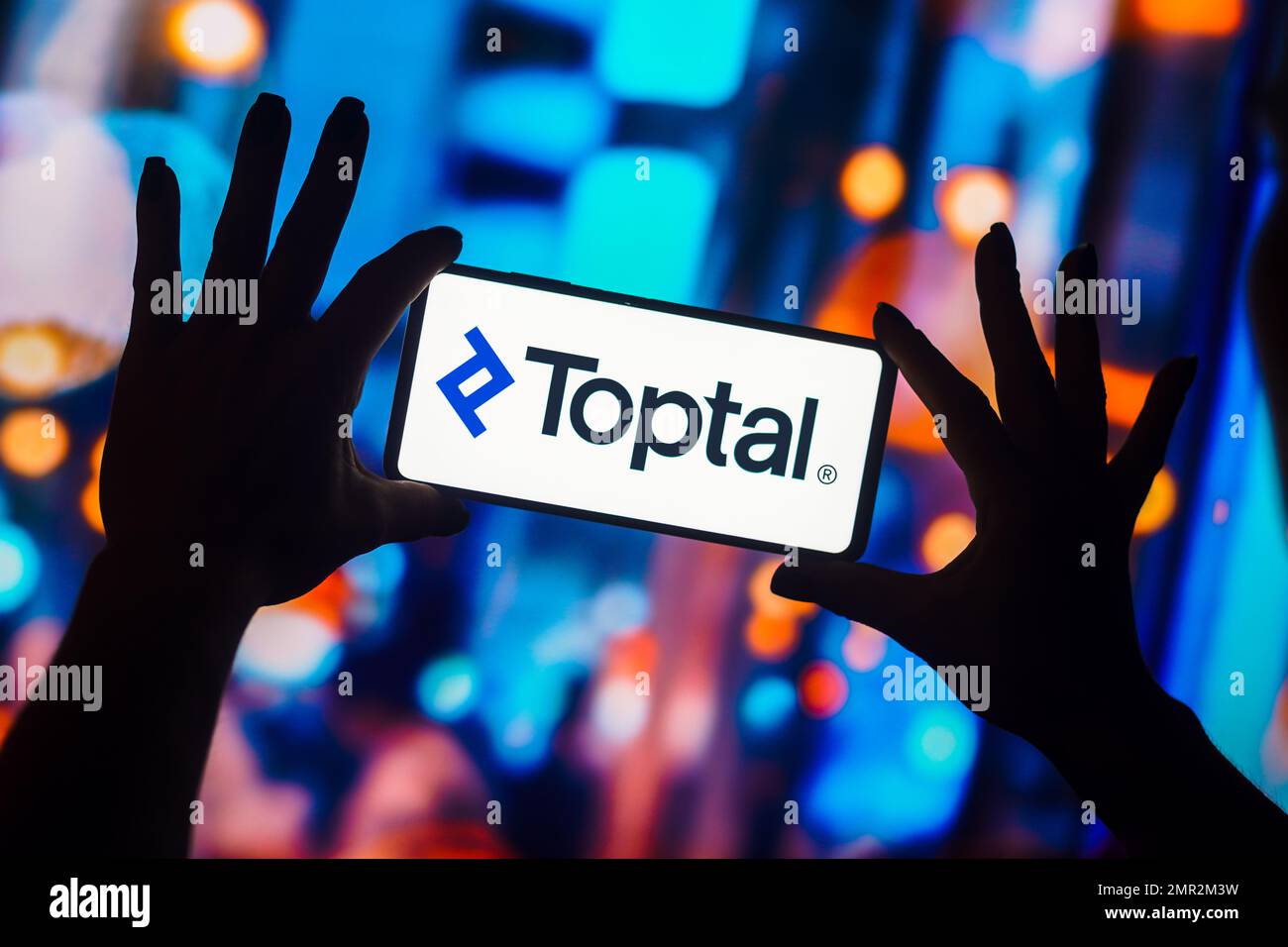 In this photo illustration, the Toptal logo is displayed on a ...