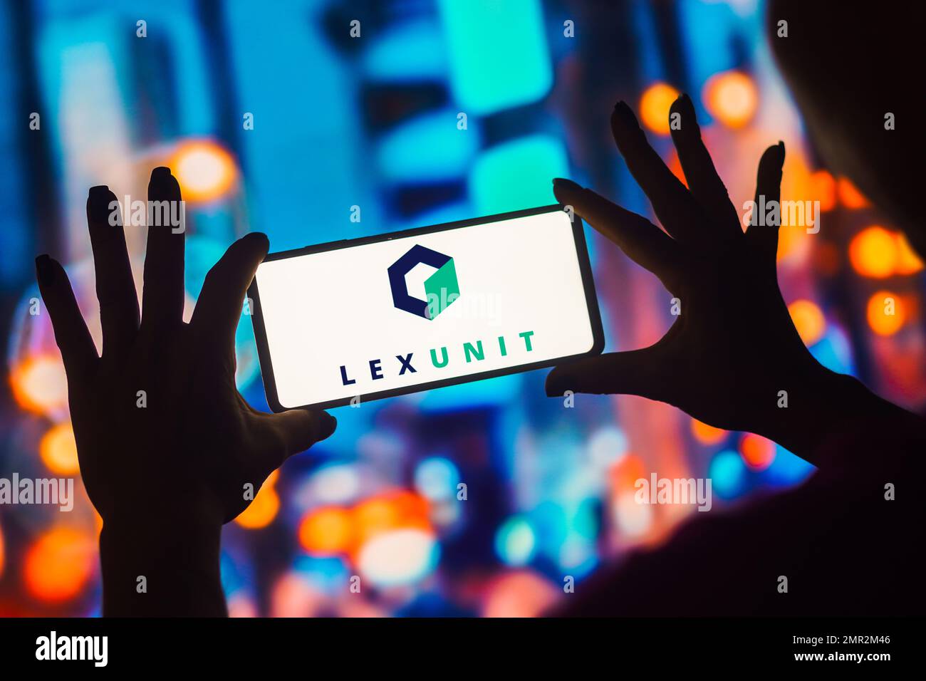 In this photo illustration, the Lexunit logo is displayed on a smartphone screen Stock Photo - Alamy