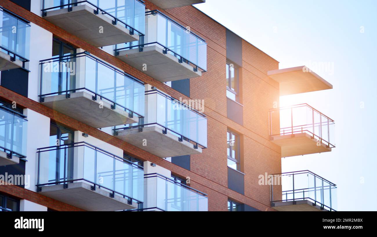 Futuristic square architecture of apartment building. Real estate with ...