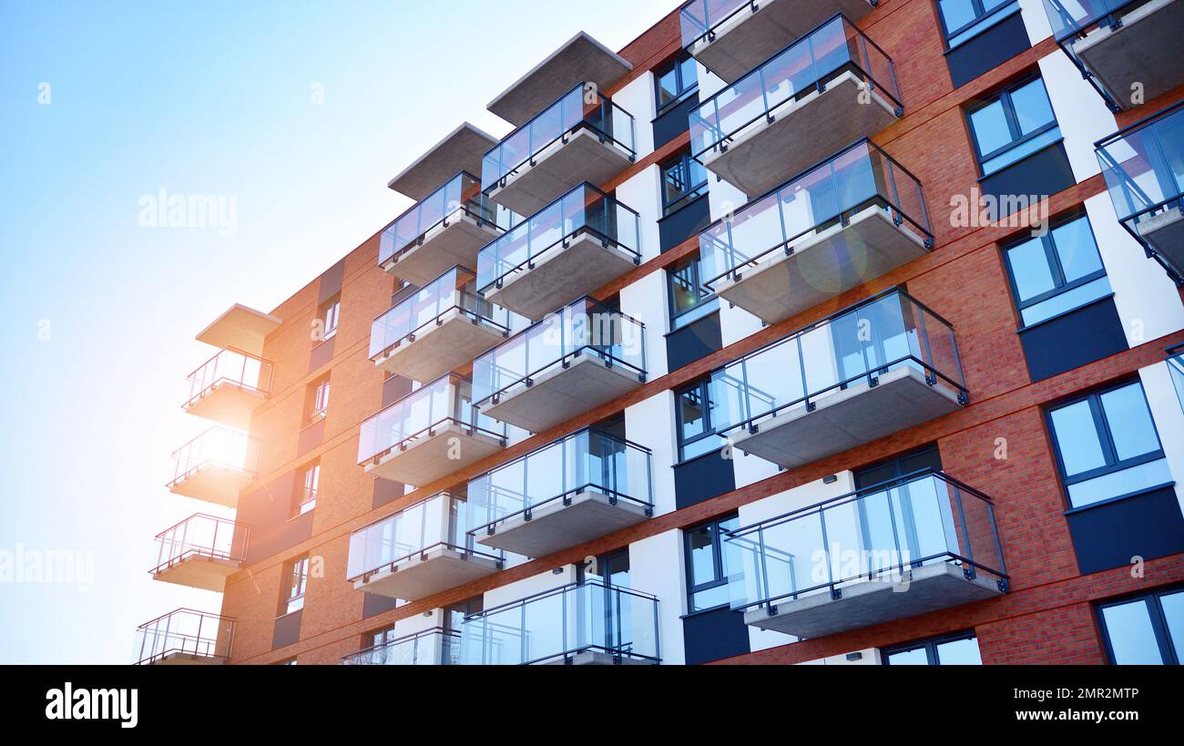 Futuristic square architecture of apartment building. Real estate with ...