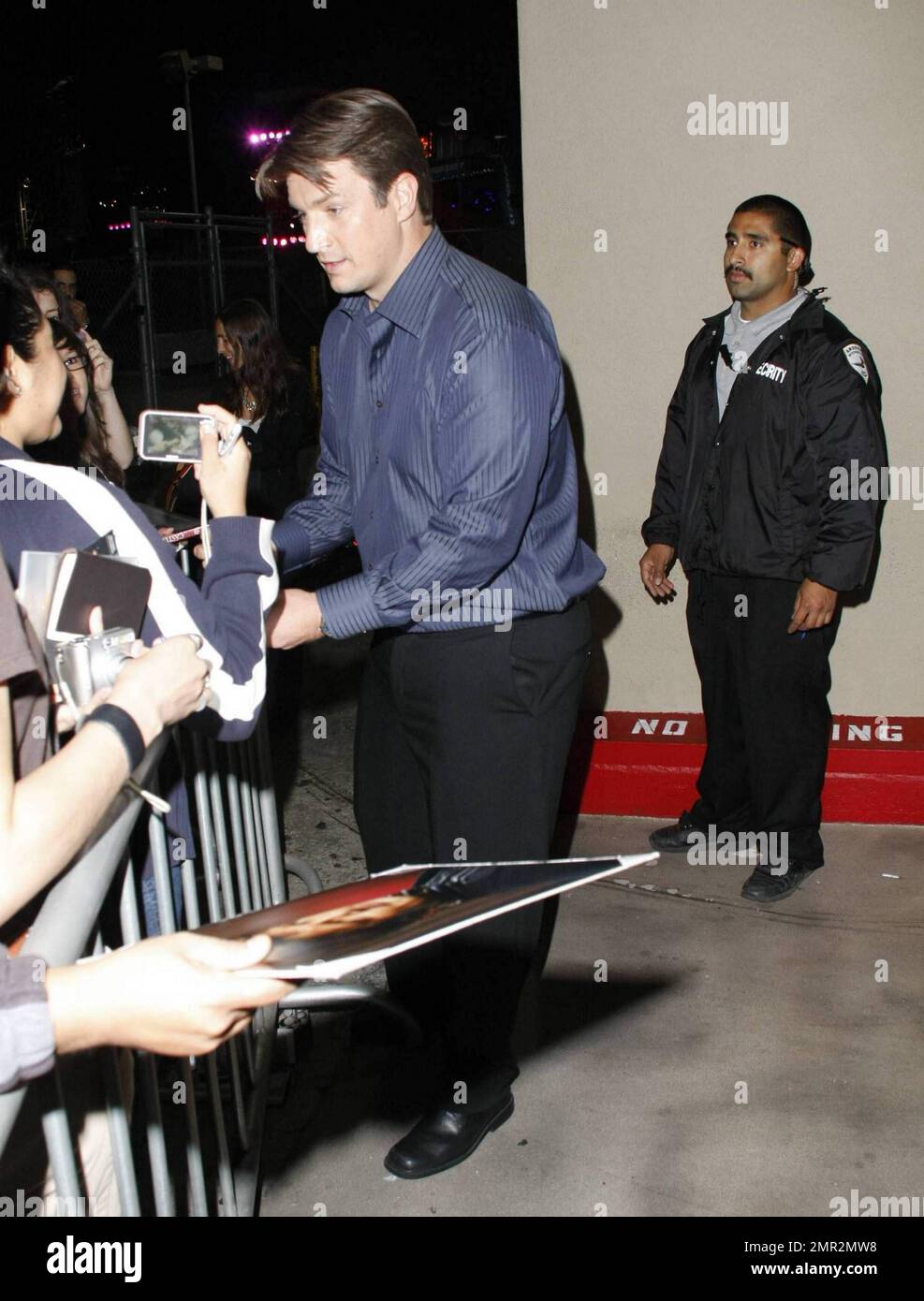 Canadian-born actor Nathan Fillion greets fans outside the Jimmy Kimmel ...