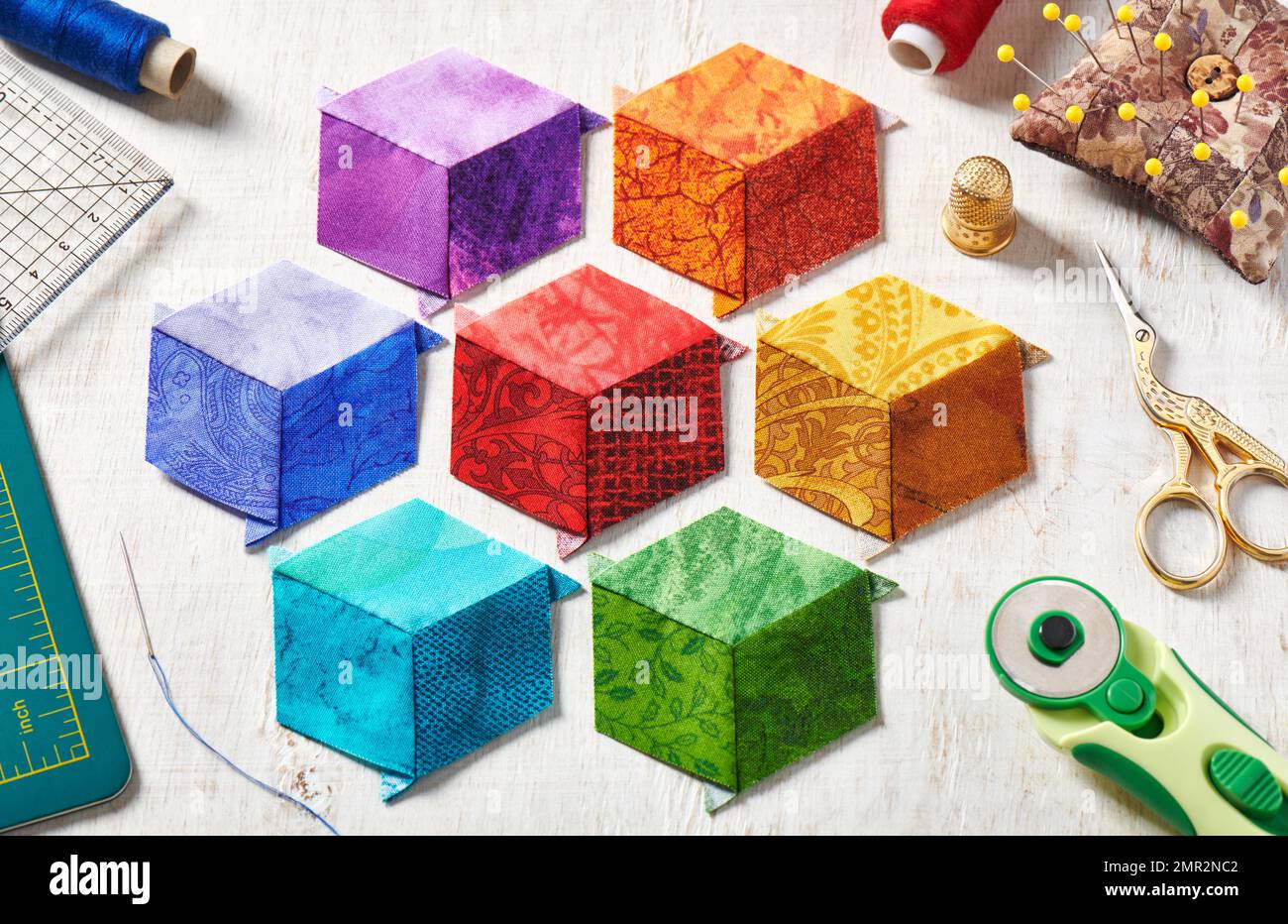 Diamonds stitched in the form of a cubes in the colors of the rainbow ...